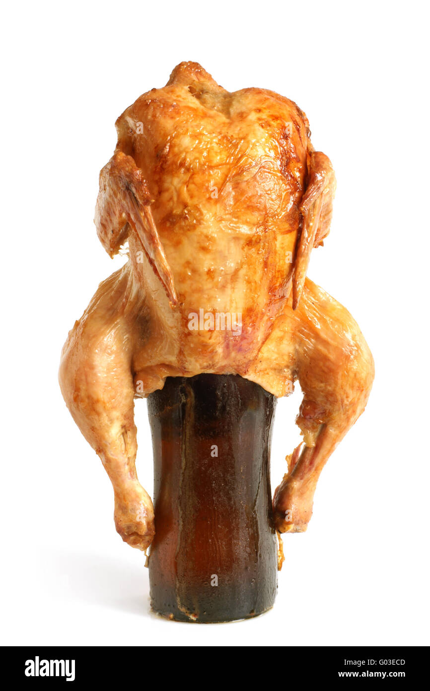 Marinated and roasted chicken on a beer bottle Stock Photo - Alamy