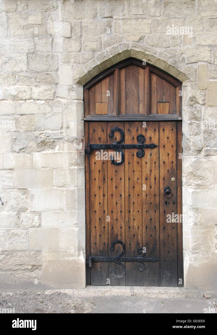 old wooden door from medieval era on stone wall castle architecture ...