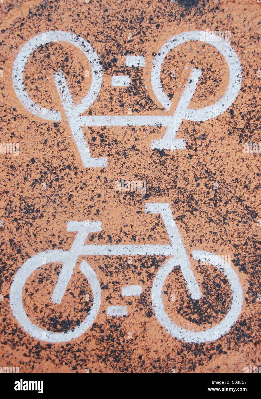 white bicycle road signs painted on orange asphalt road Stock Photo - Alamy