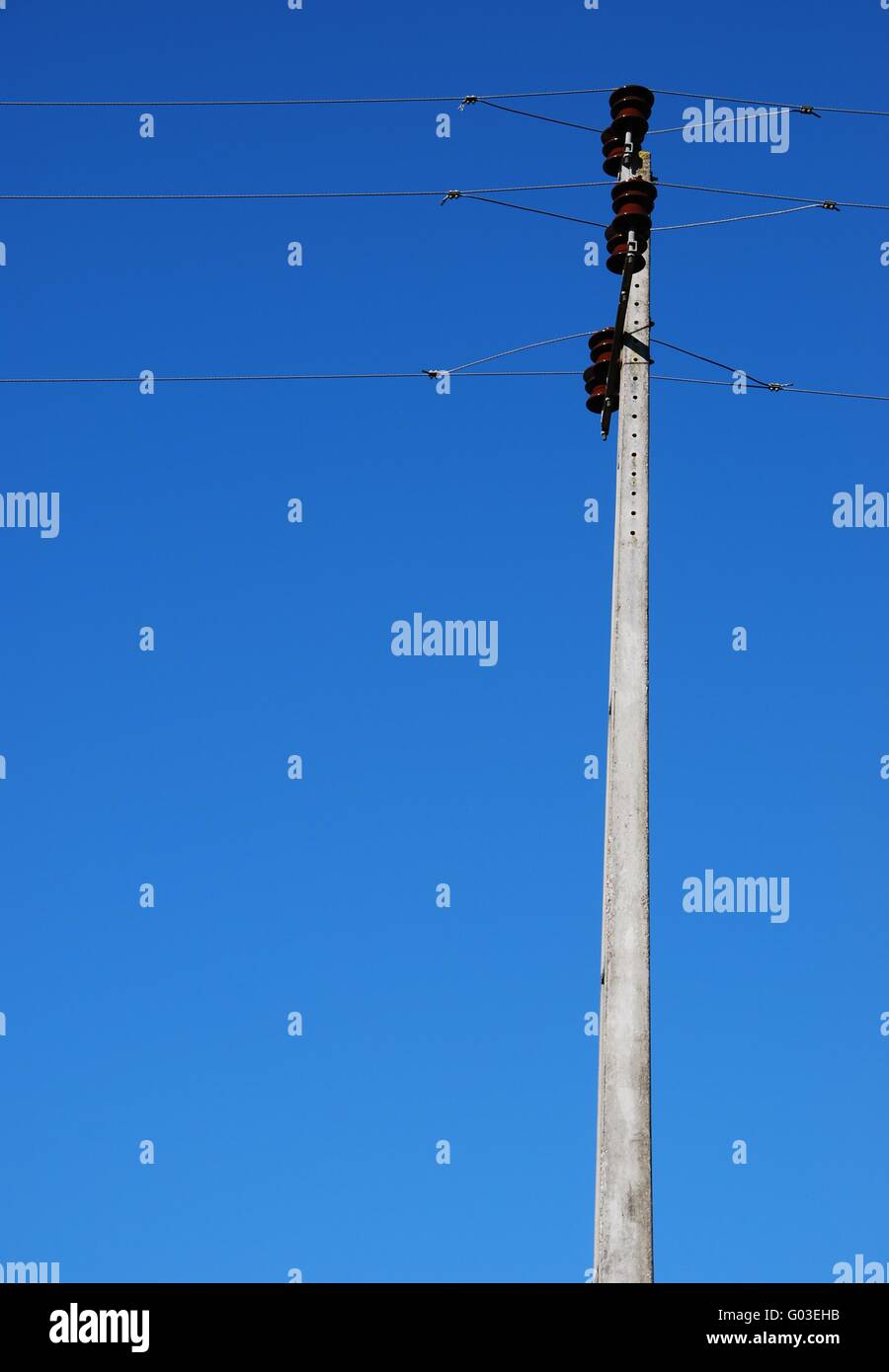 old electricity post in a small village (blue sky background Stock ...