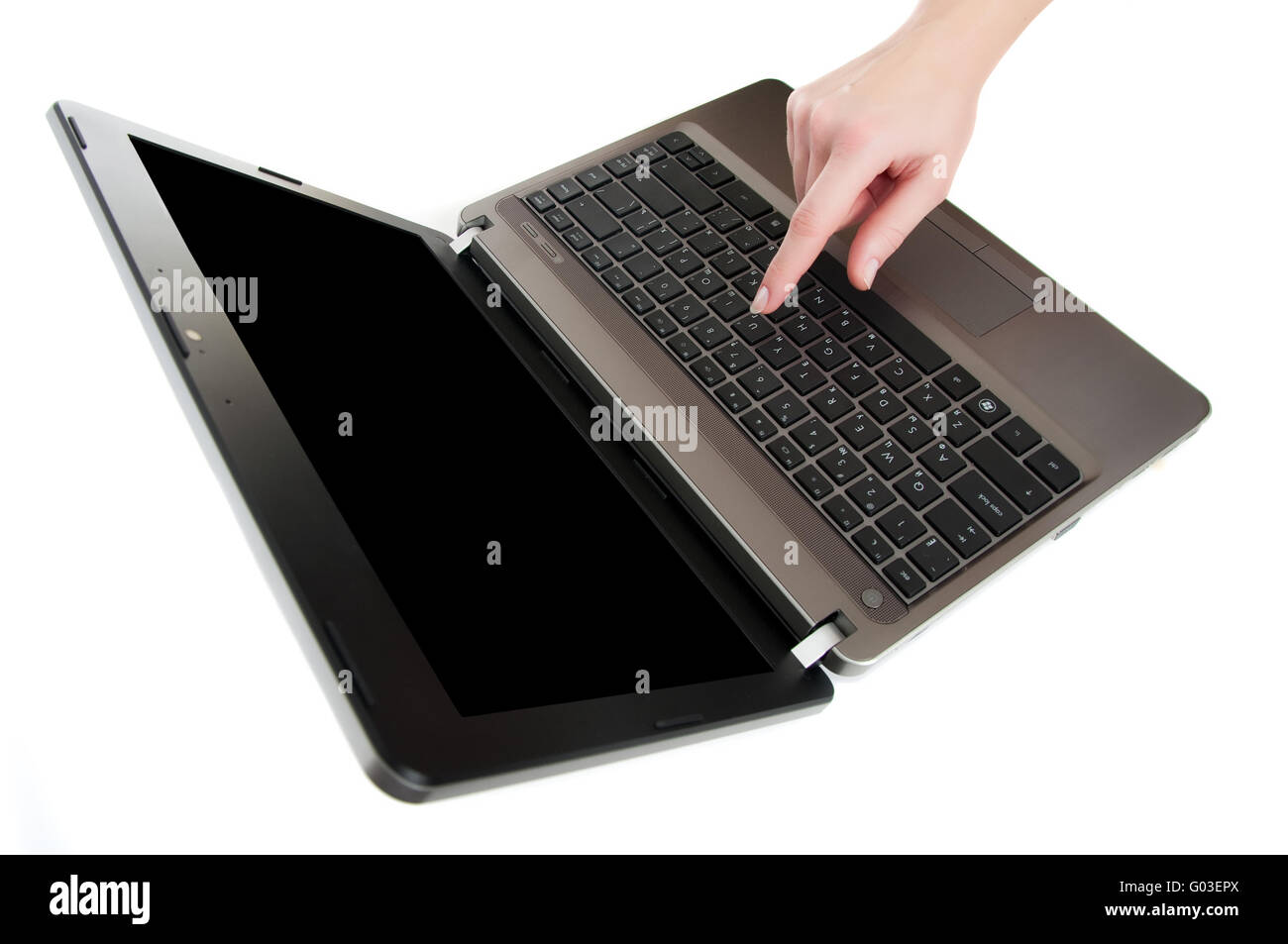 female hand pushing a button on laptop keyboard with the finger with ...