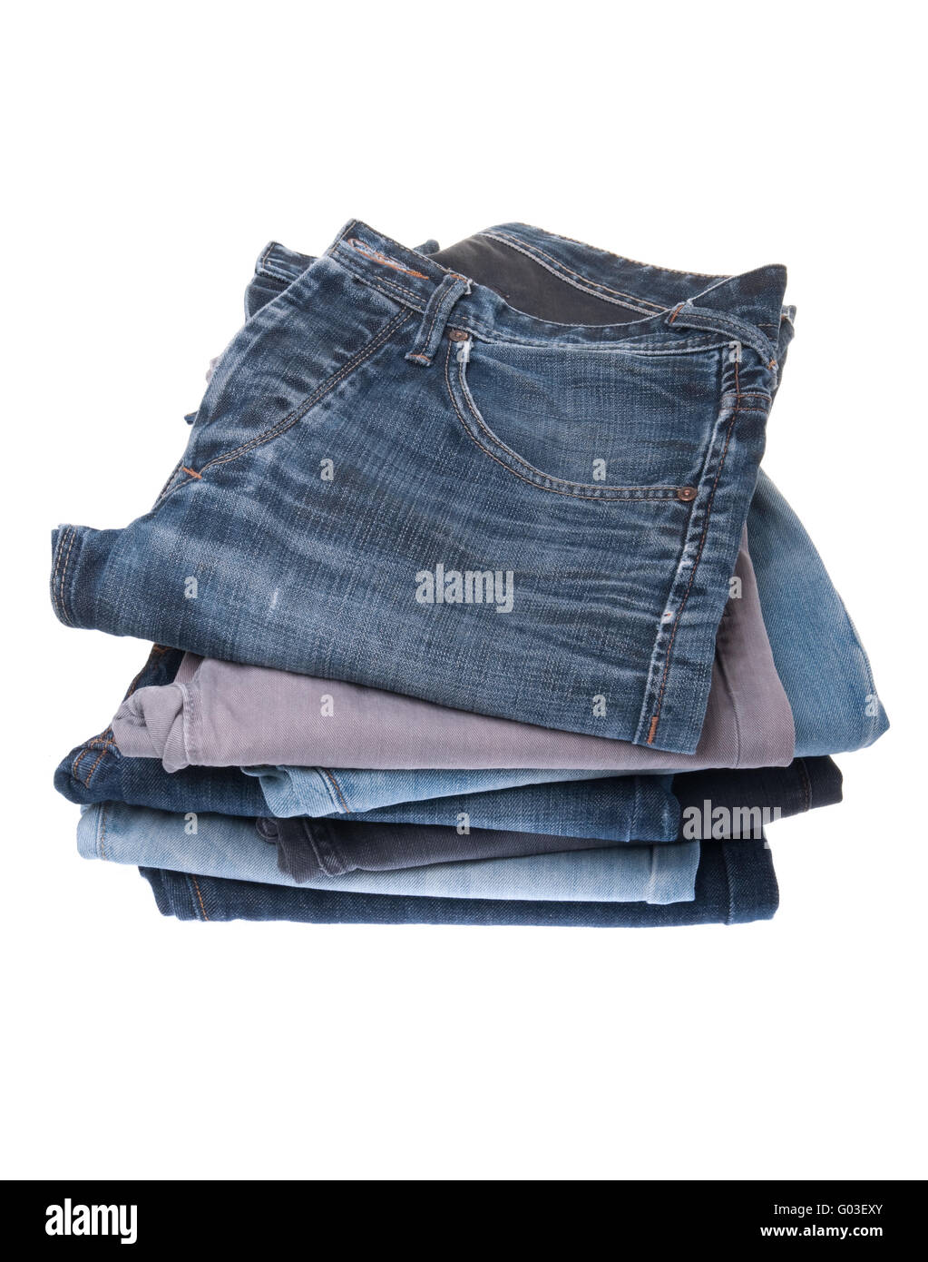stack of various jeans isolated on white background Stock Photo - Alamy