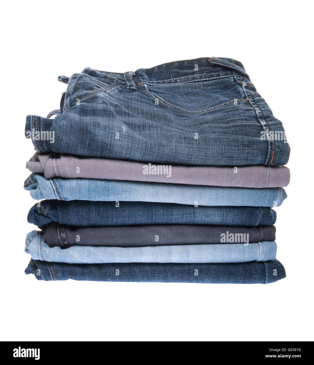 stack of various jeans isolated on white background Stock Photo - Alamy