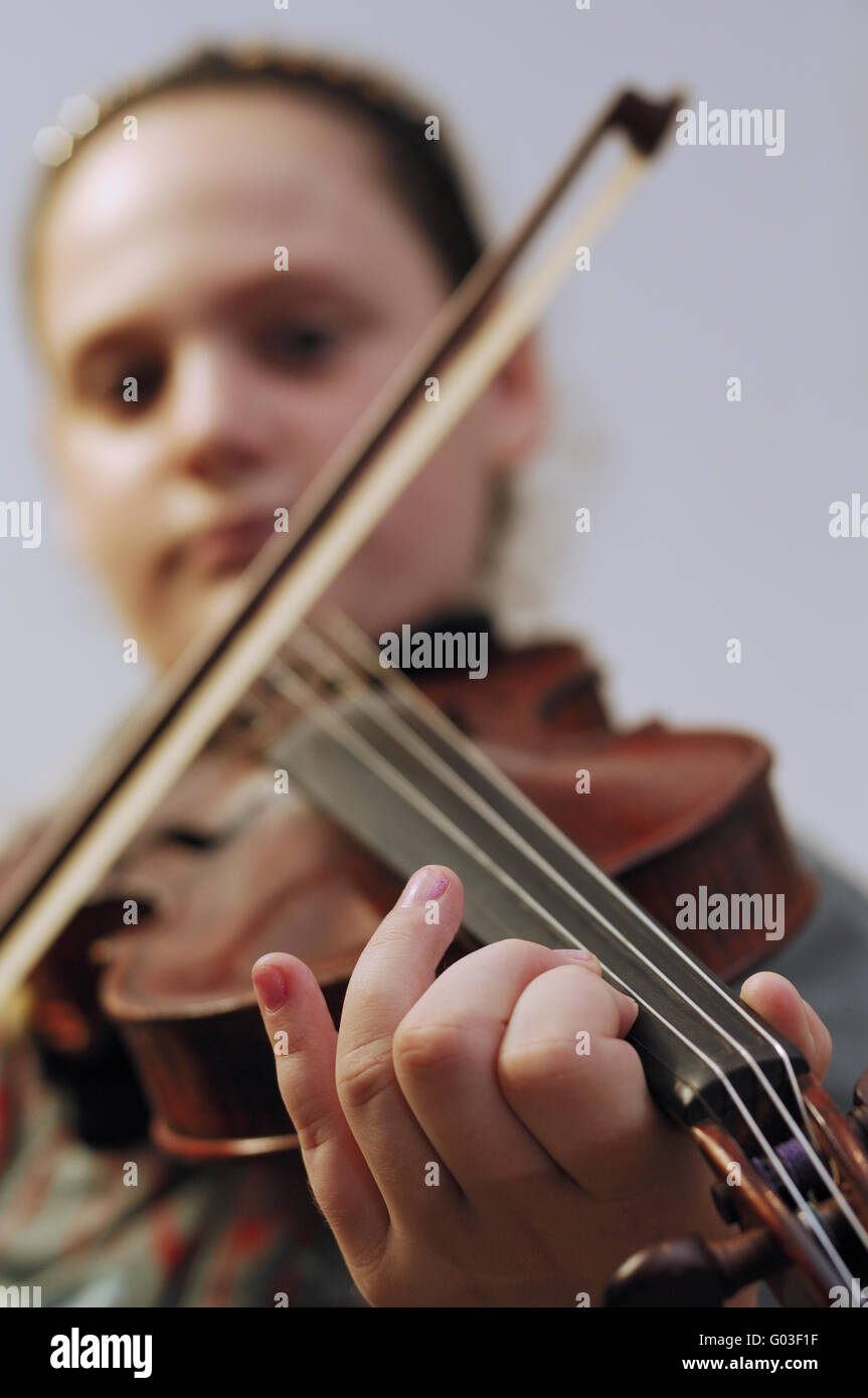 Cute little girl learn viola lesson Stock Photo - Alamy
