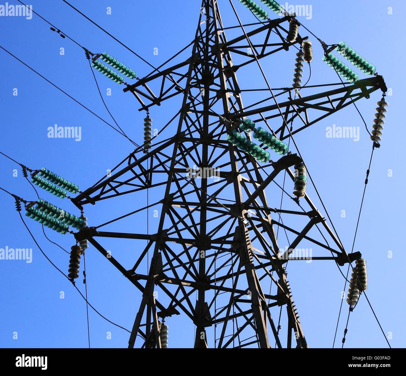 Electricity pylon against blue sky. Close up Stock Photo - Alamy