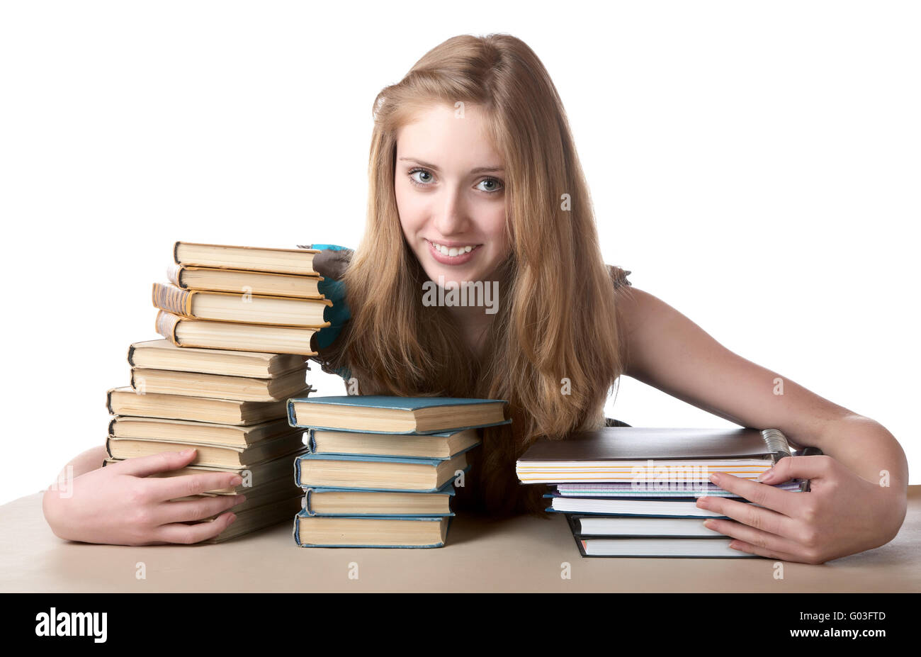 The girl embraces a pile of books and writing-books Stock Photo - Alamy