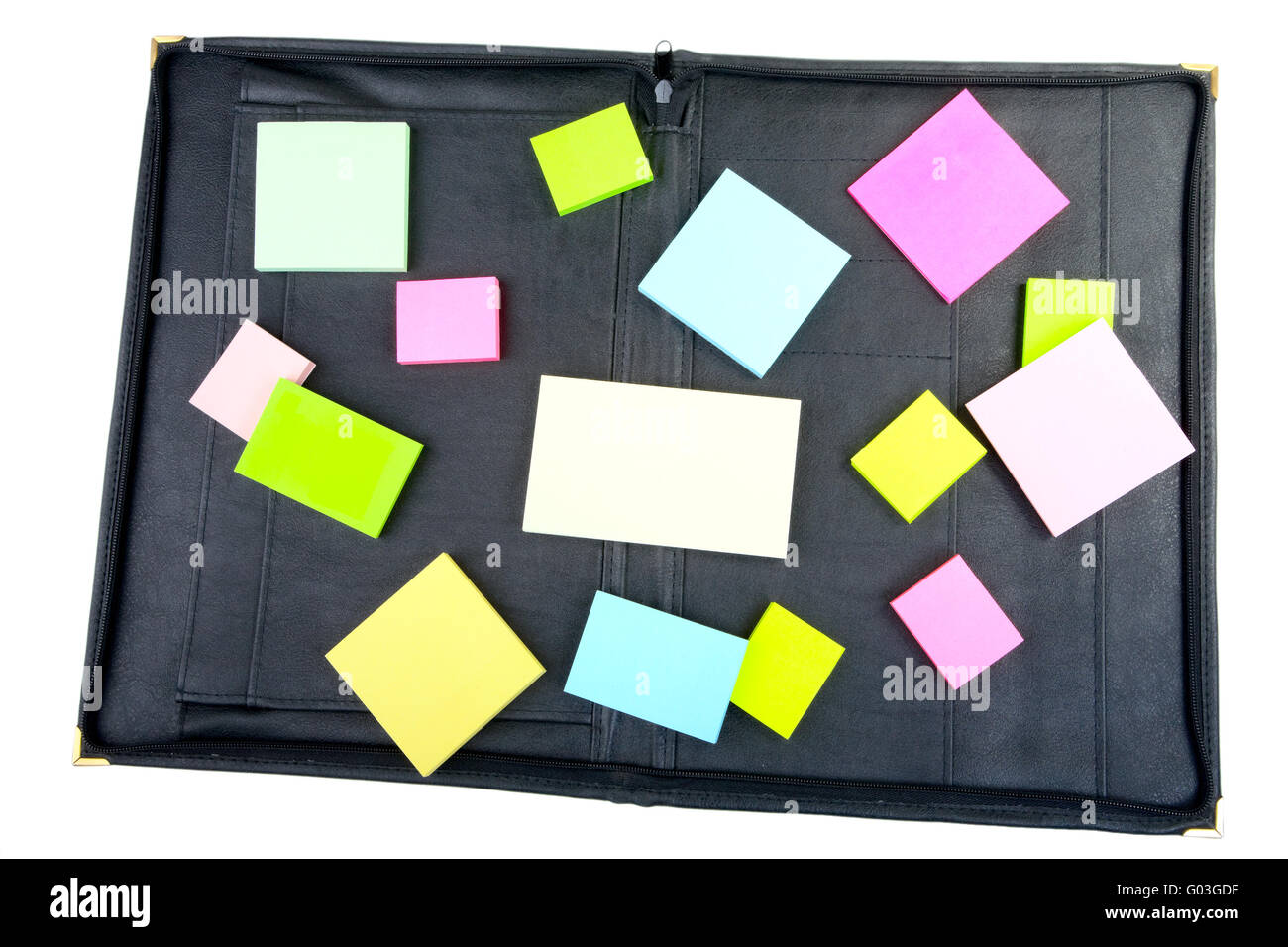 Leather folder with the scattered piles of stickers Stock Photo - Alamy