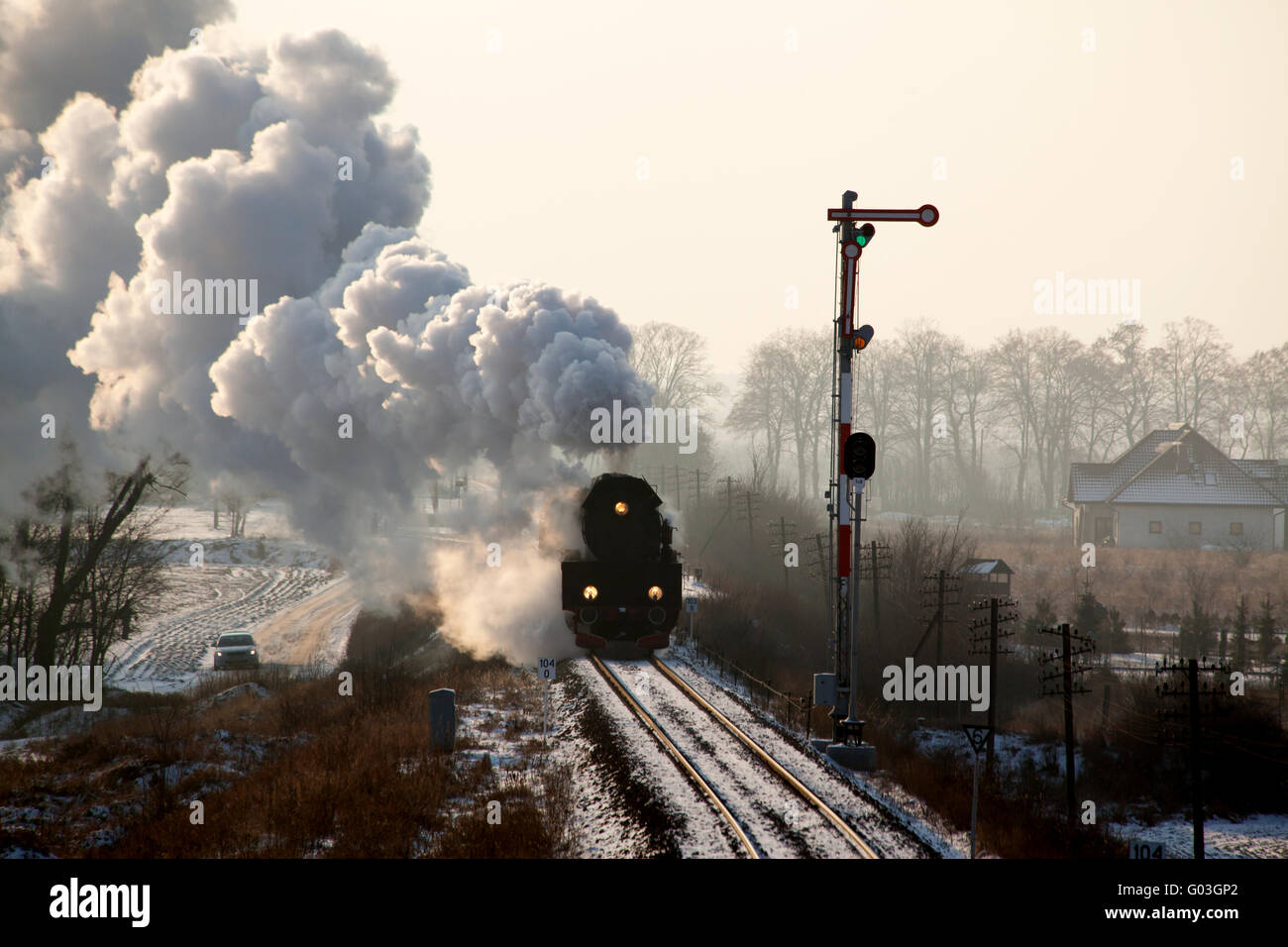 Vintage steam train starting from the station Stock Photo - Alamy