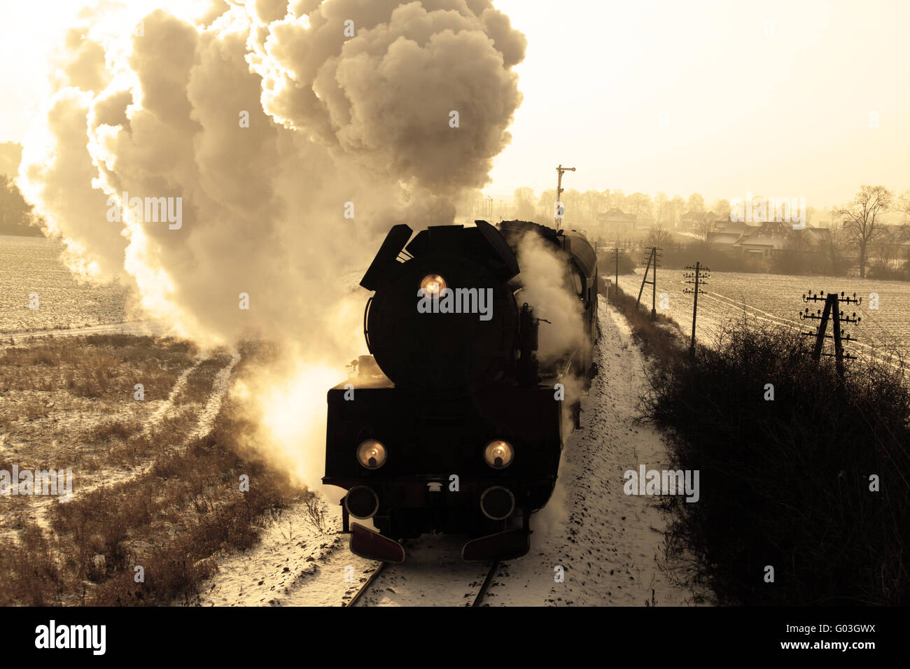Vintage steam train starting from the station Stock Photo - Alamy