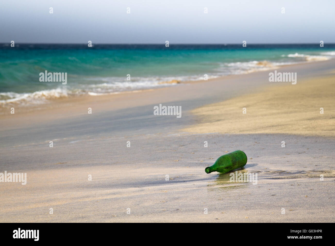 Flotsam and jetsam, a bottle, floating debris, bot Stock Photo - Alamy