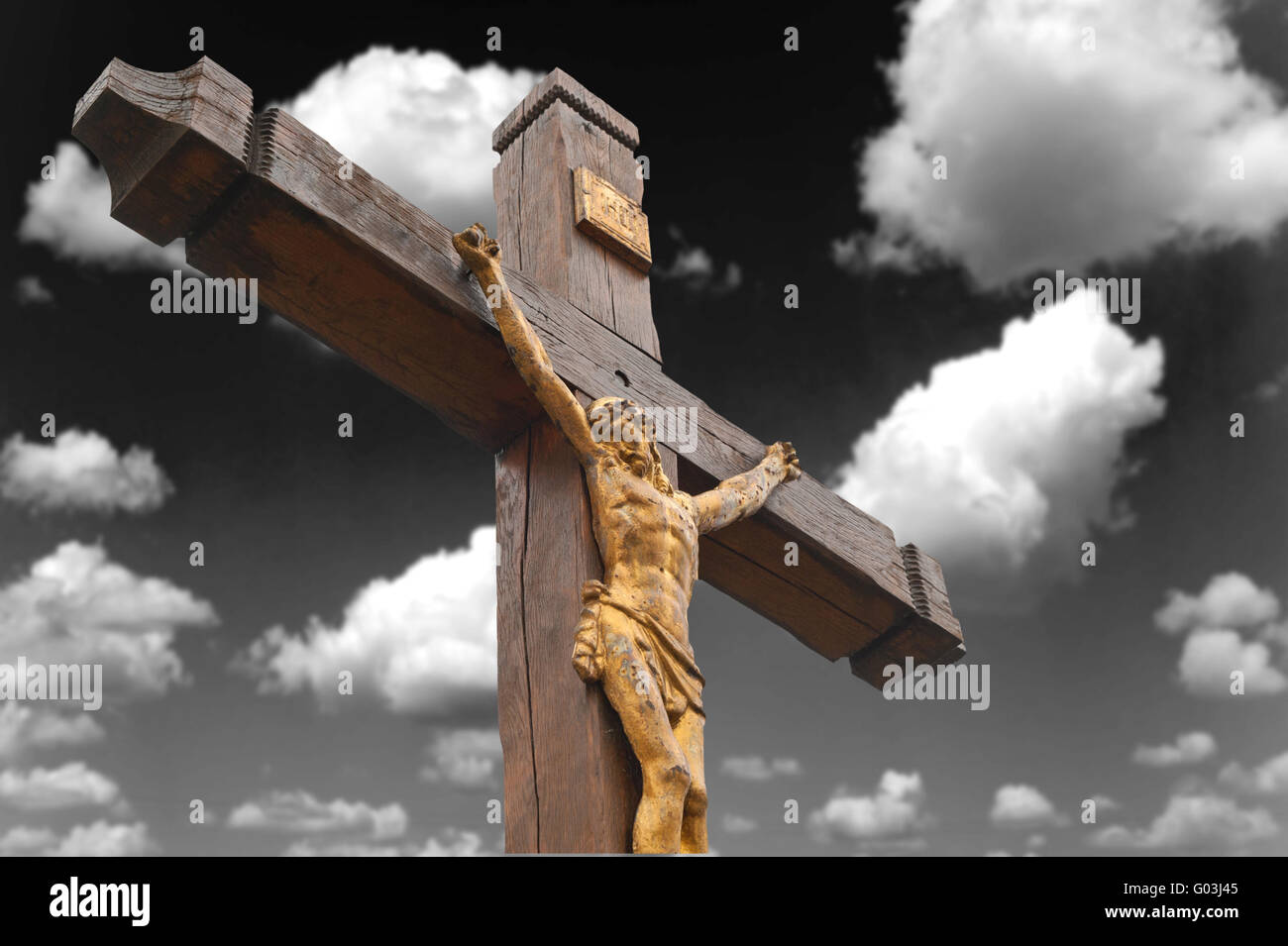 The crucifixion from a tree with Jesus's gilt figure Stock Photo - Alamy