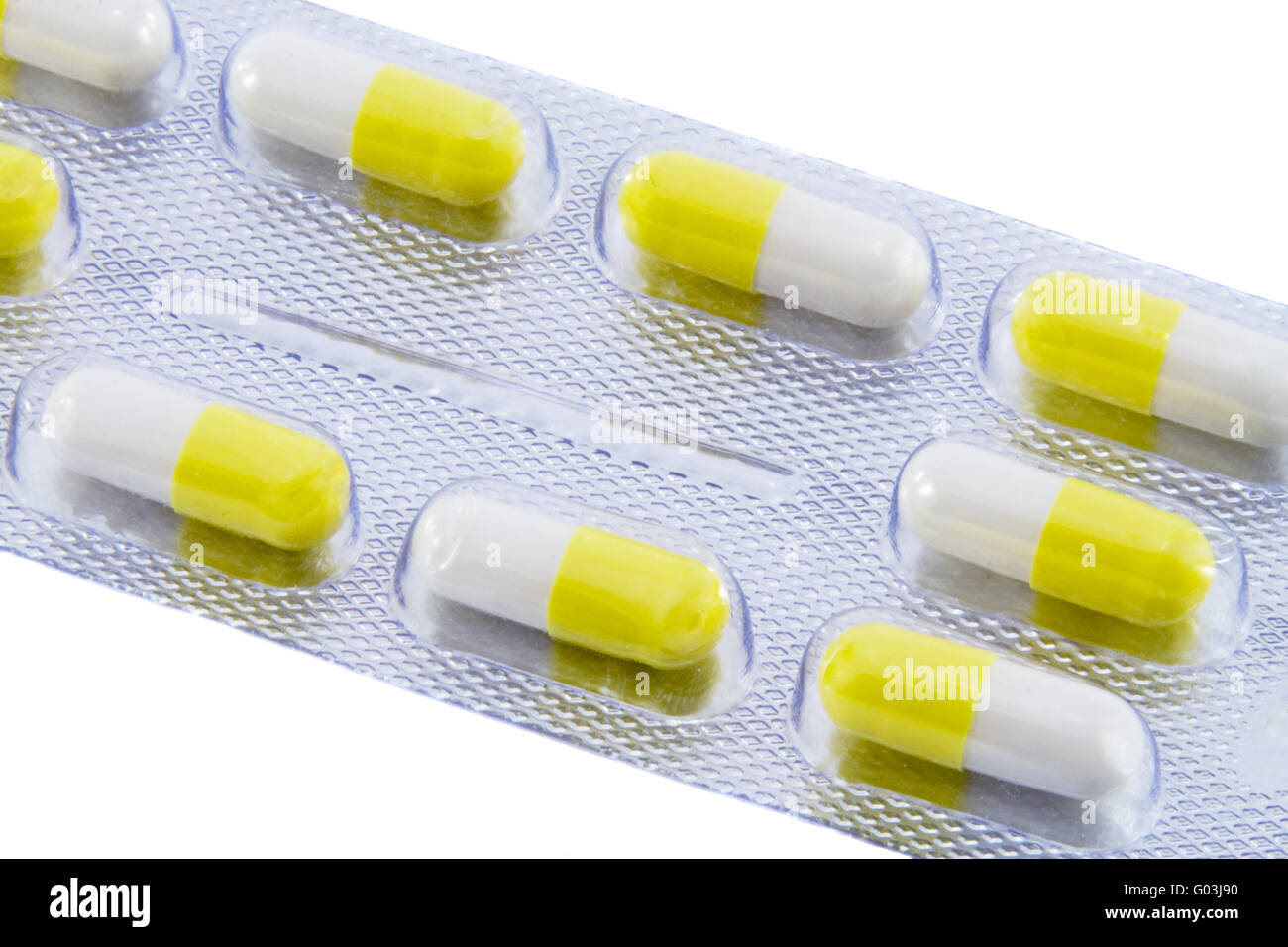 Many different color tablets and pills isolated over white background ...