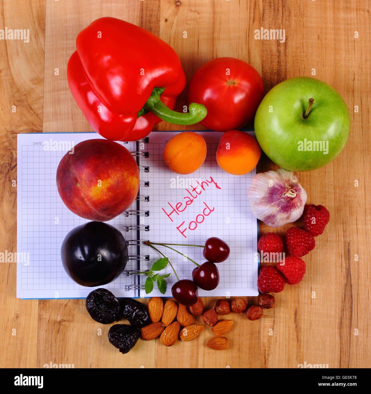Fresh fruits and vegetables with notebook for writing notes, concept of ...
