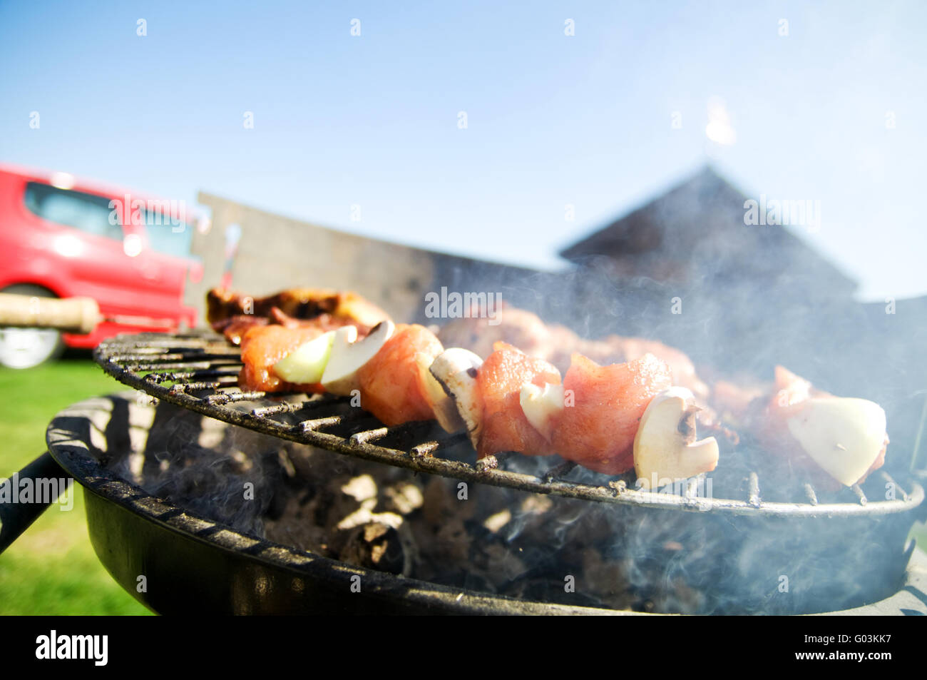 Cooking on the barbecue grill. Outdoor weekend time Stock Photo - Alamy