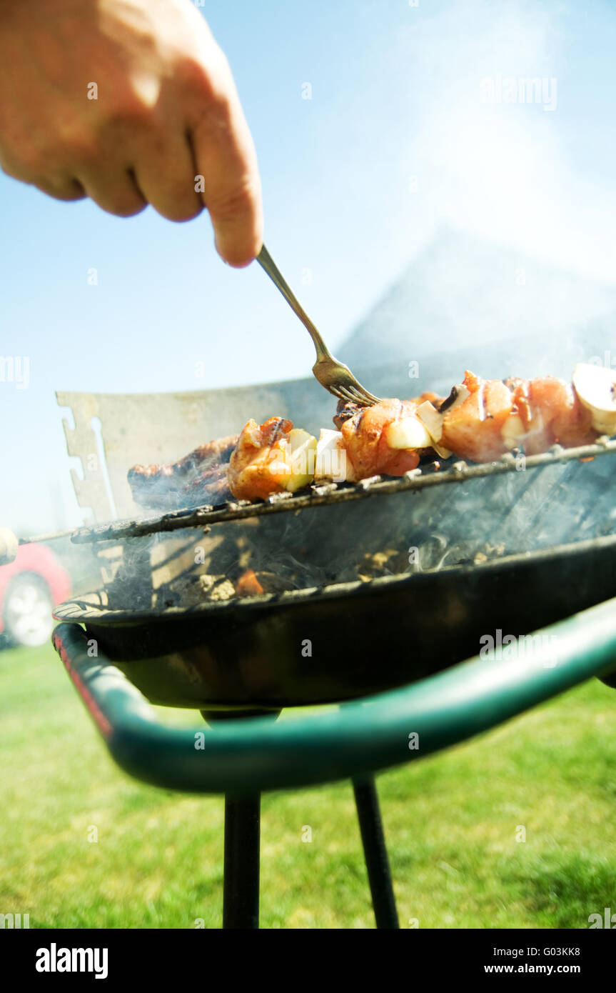 Cooking on the barbecue grill. Outdoor weekend time Stock Photo - Alamy
