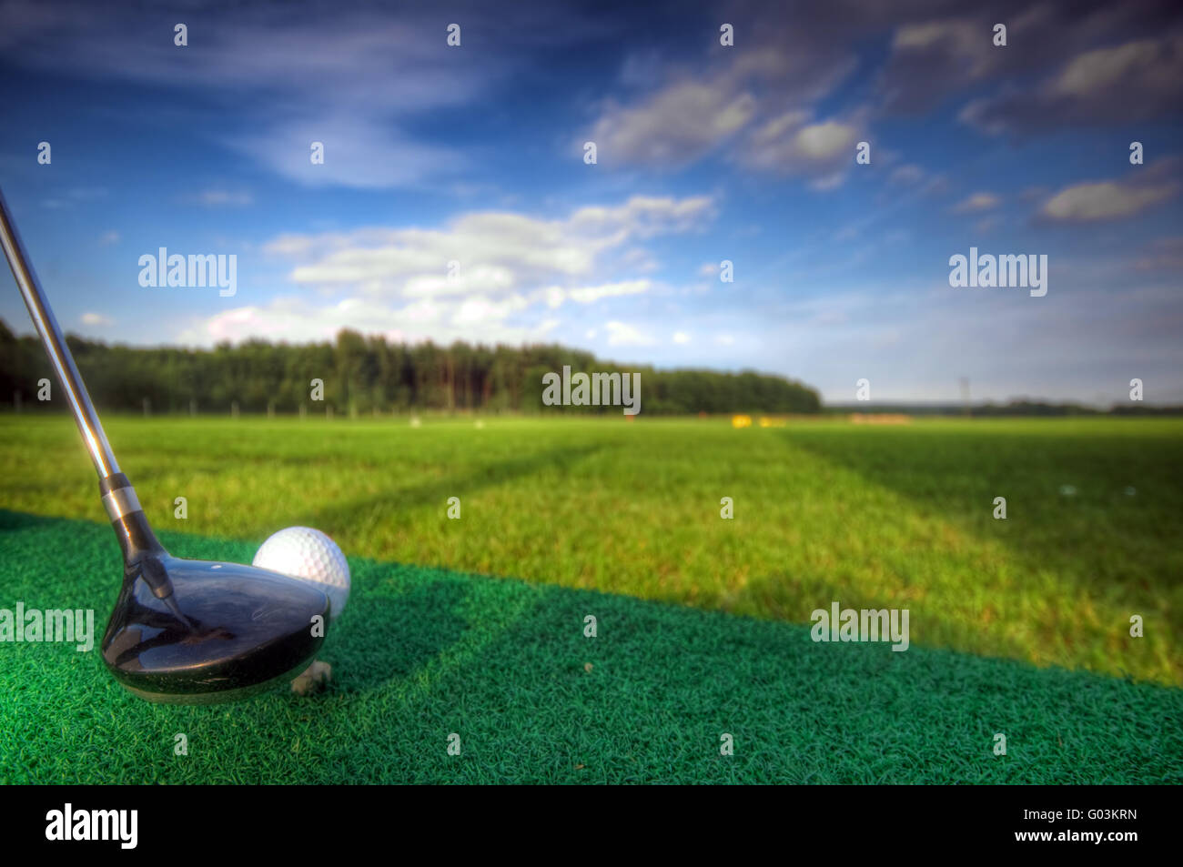 Playing golf. Golf club and ball. Preparing to shot Stock Photo - Alamy