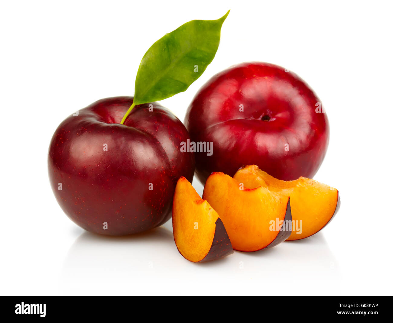 Ripe plums fruit with slices isolated on white Stock Photo - Alamy