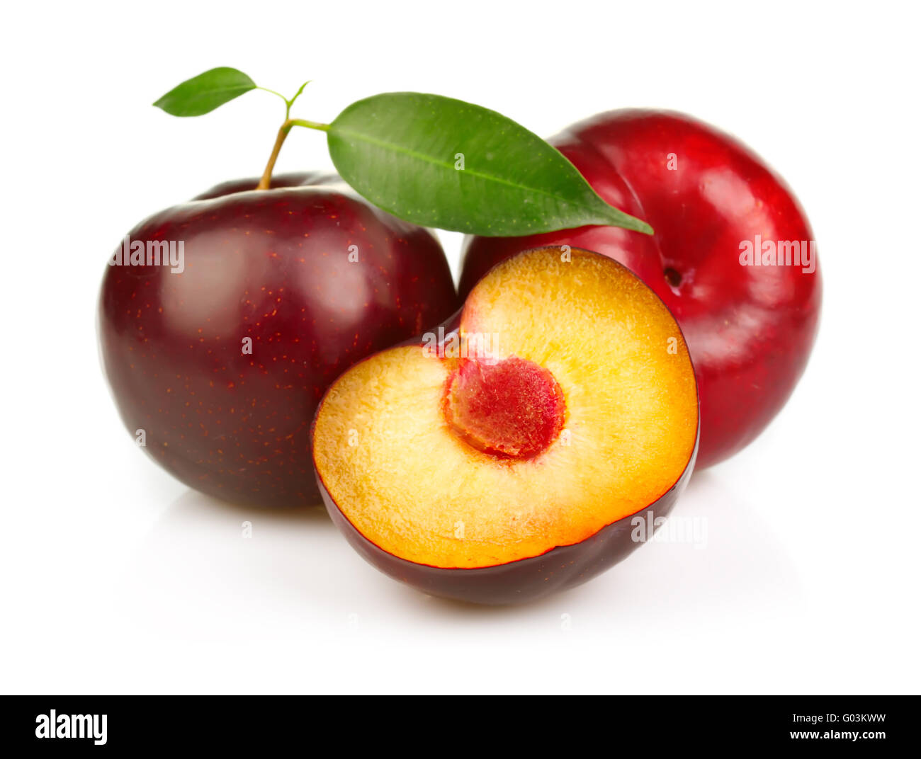 Ripe plums fruit with slices isolated on white Stock Photo - Alamy