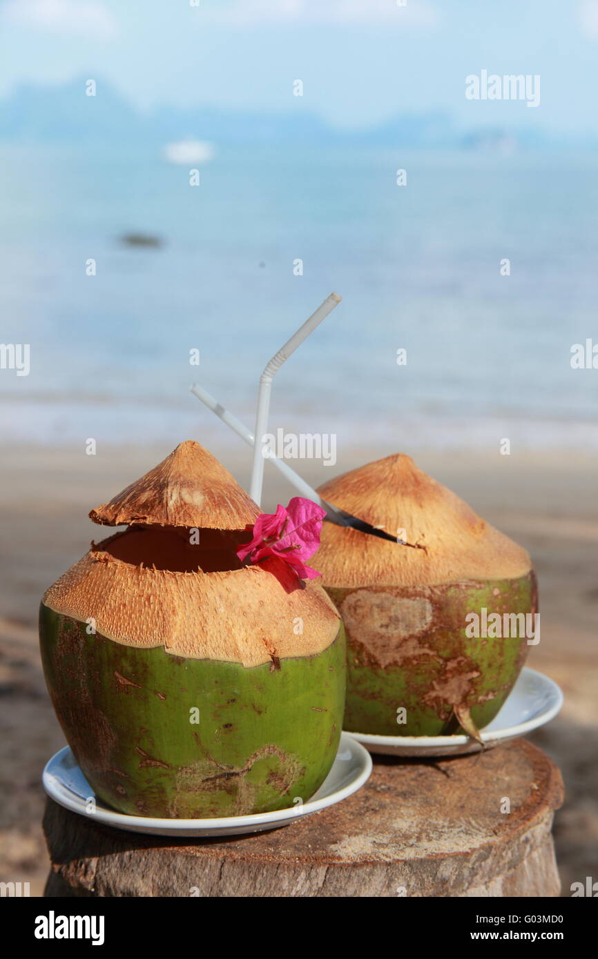Couple drinking coconut straw hi-res stock photography and images - Alamy