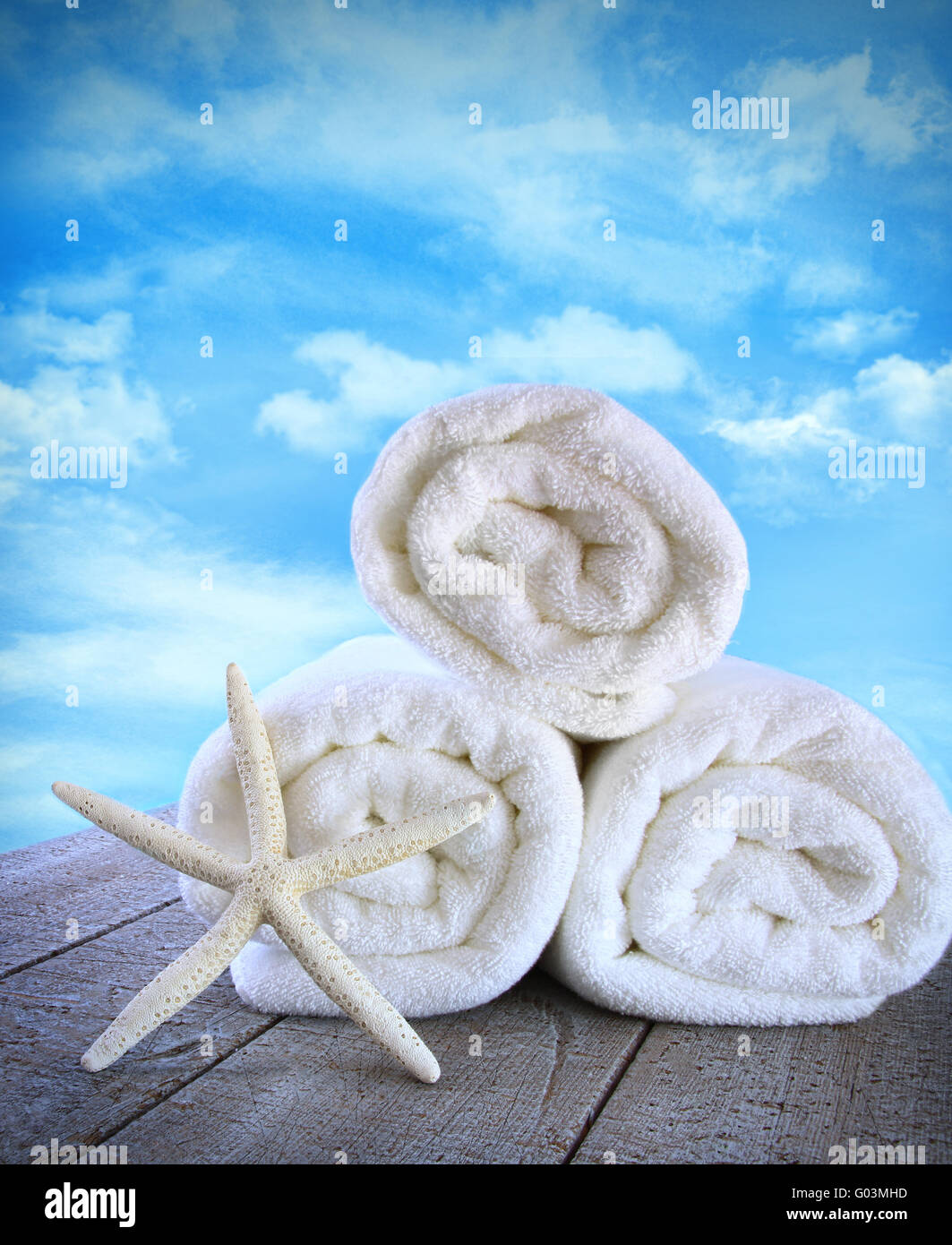 Fluffy fresh towels against a blue sky with clouds Stock Photo - Alamy
