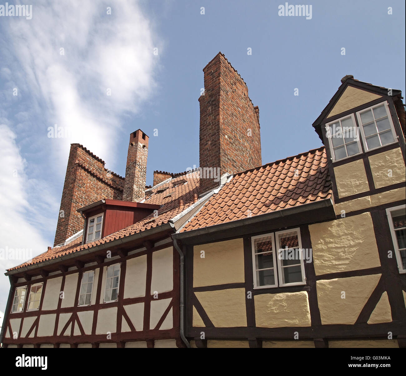 old houses built in a half tower Stock Photo - Alamy