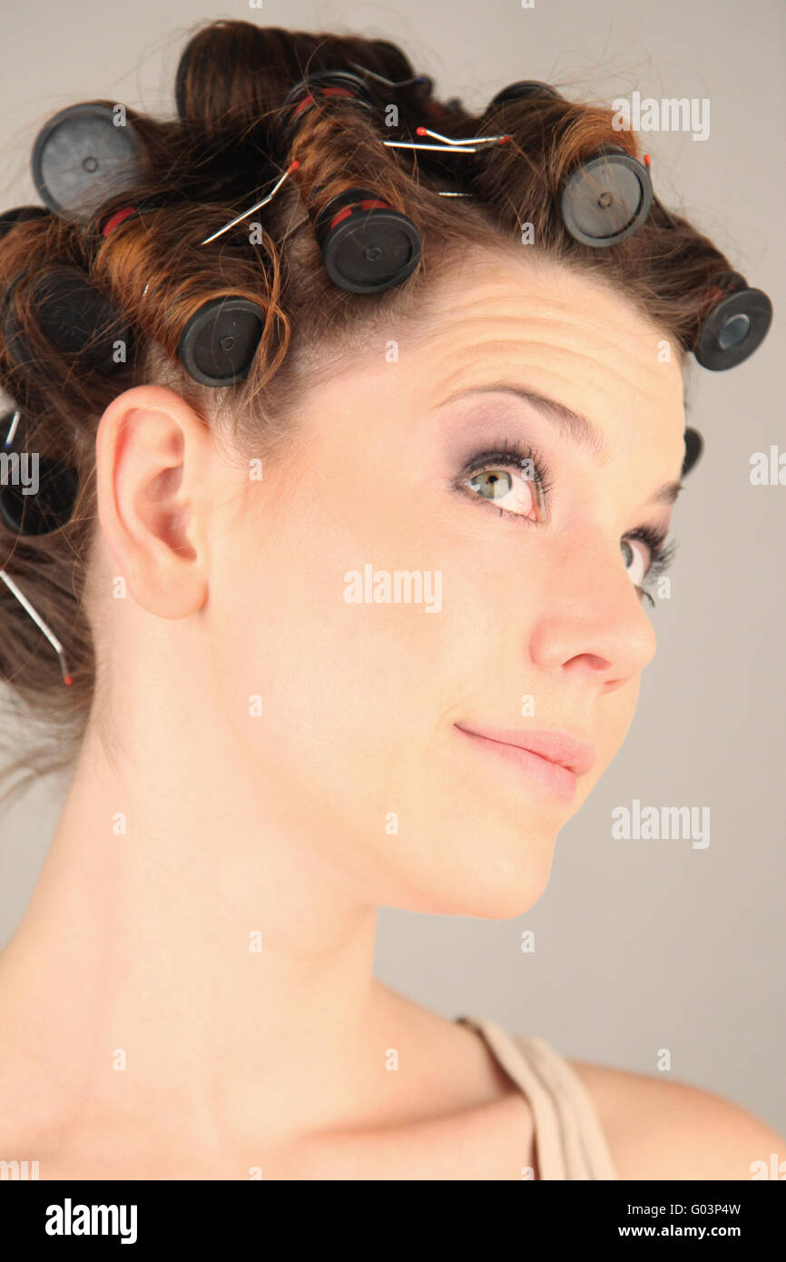 Young woman in curlers Stock Photo - Alamy