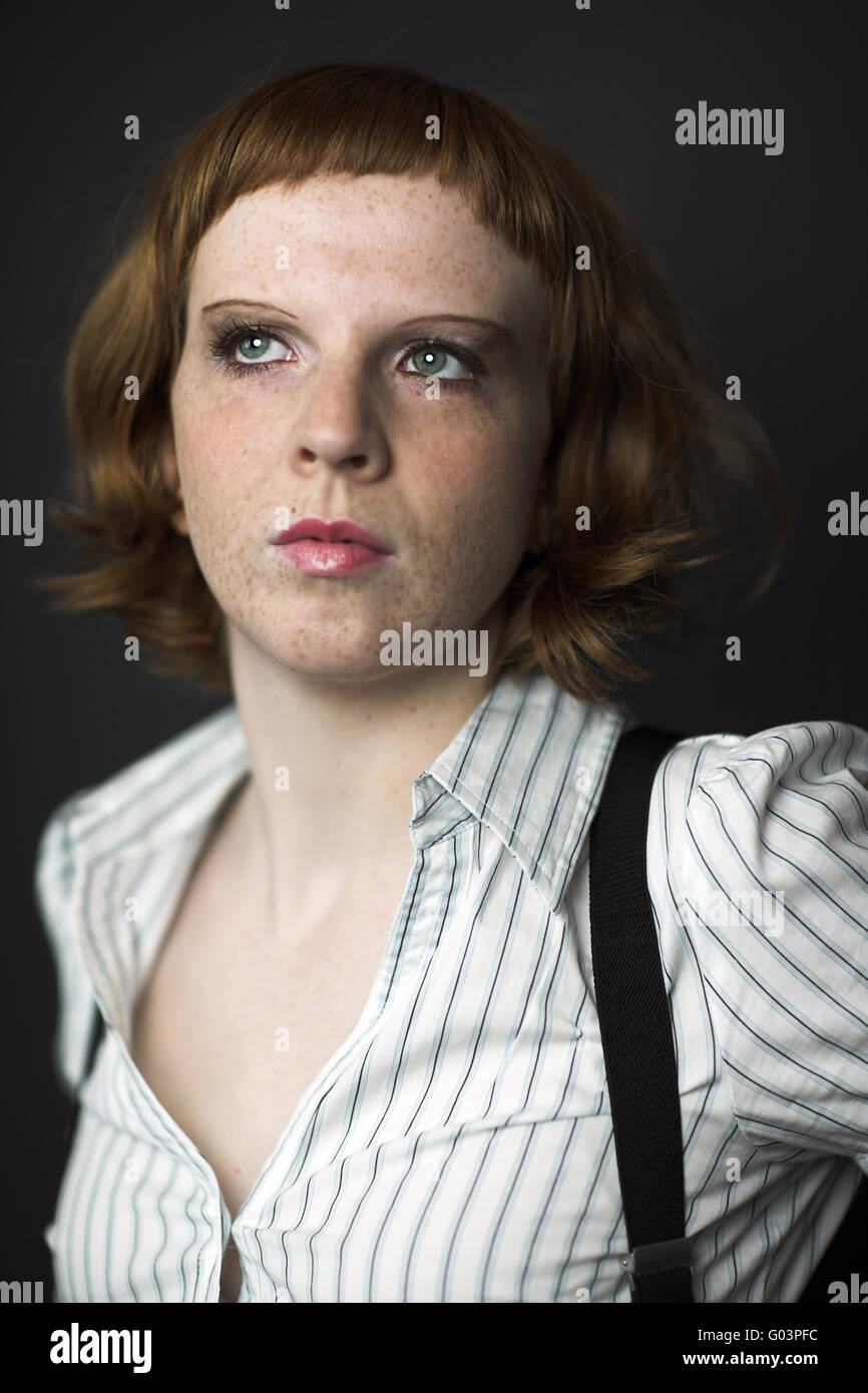 Young woman in 20s style on a black background Stock Photo - Alamy