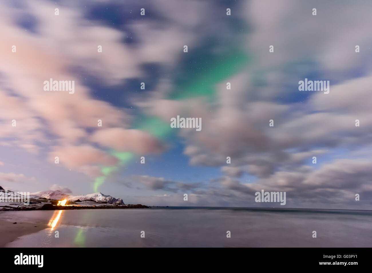 Northern lights over the sea at Skagsanden Beach, Lofoten Islands ...