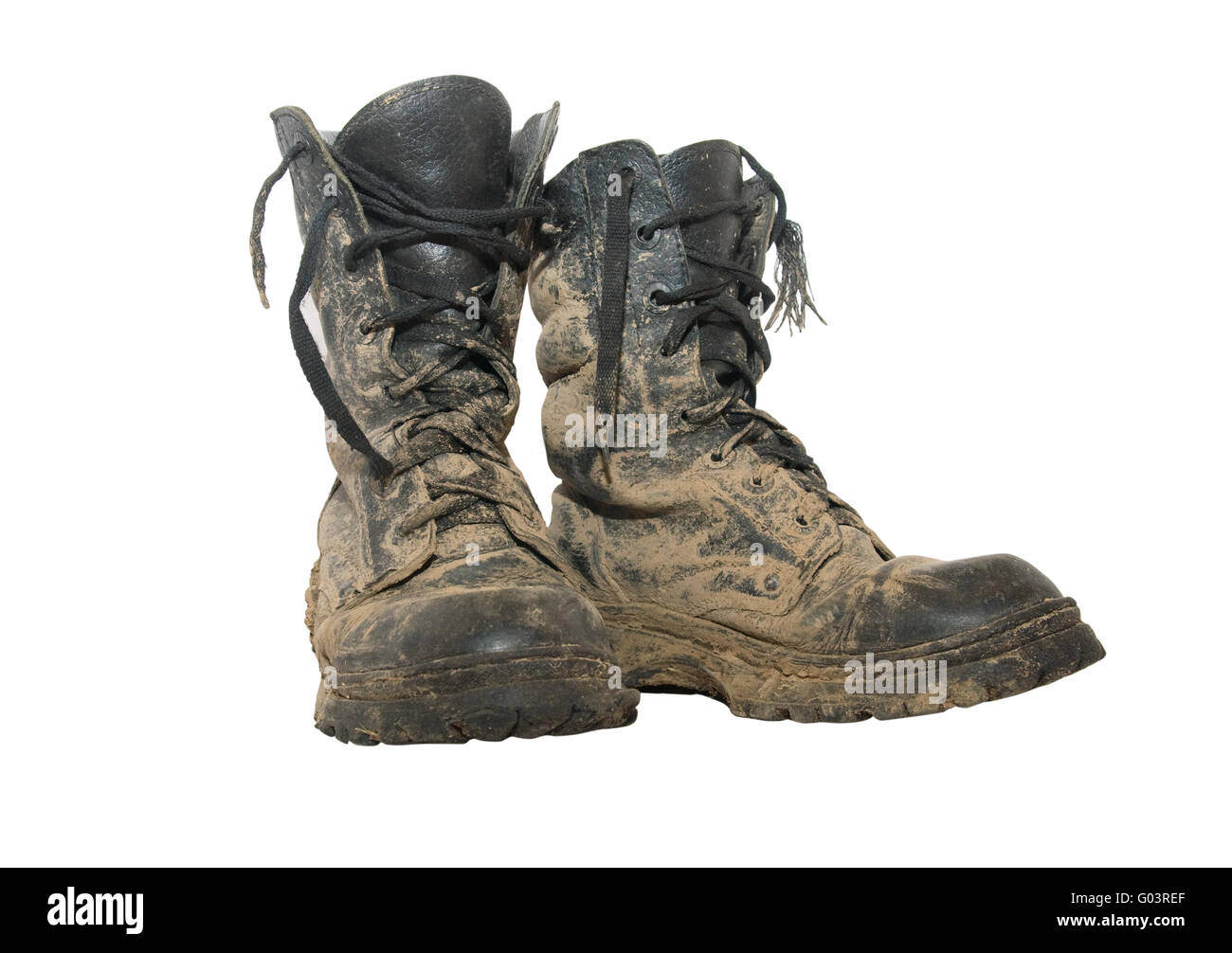 A pair of dirty hiking boots isolated over white Stock Photo - Alamy