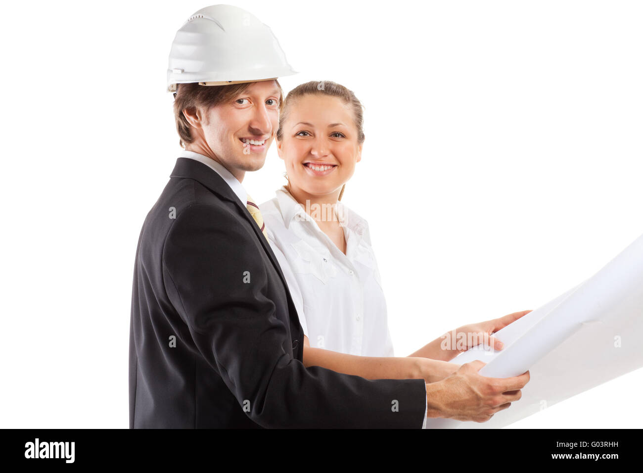 An architect wearing a hard hat and co-worker Stock Photo - Alamy