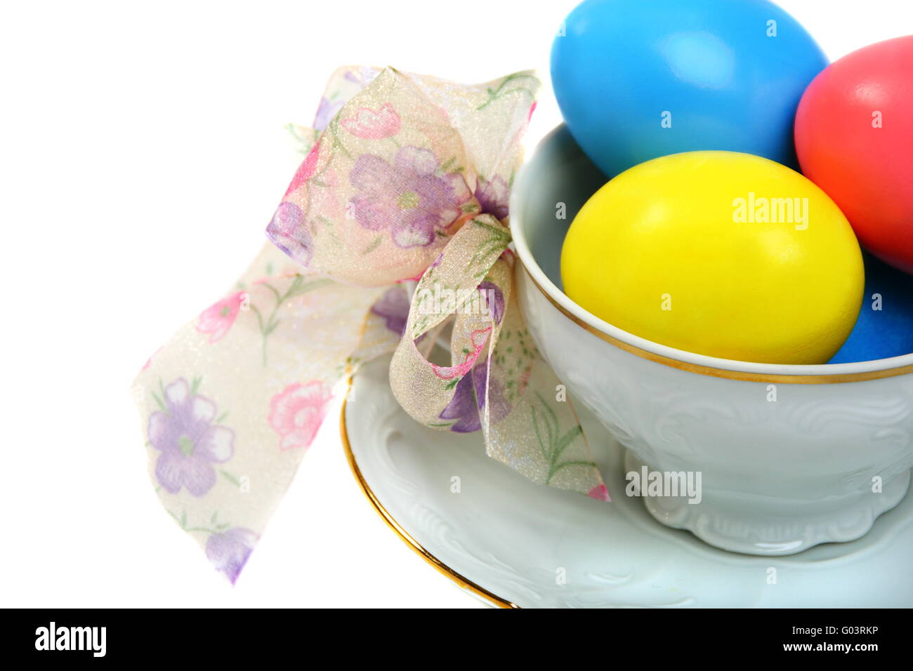 Easter eggs in a teacup on a white background Stock Photo - Alamy