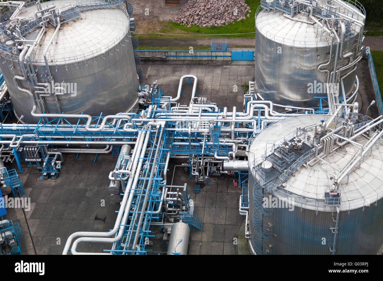 Silver industrial oil container with stairs in a r Stock Photo - Alamy