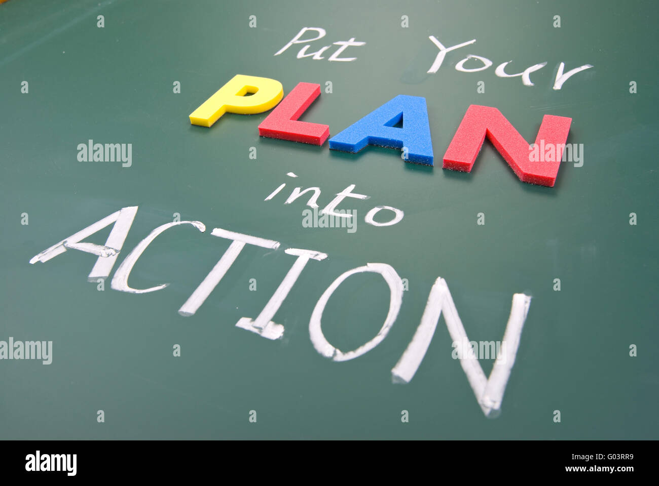 Put your plan into action, words on blackboard Stock Photo - Alamy