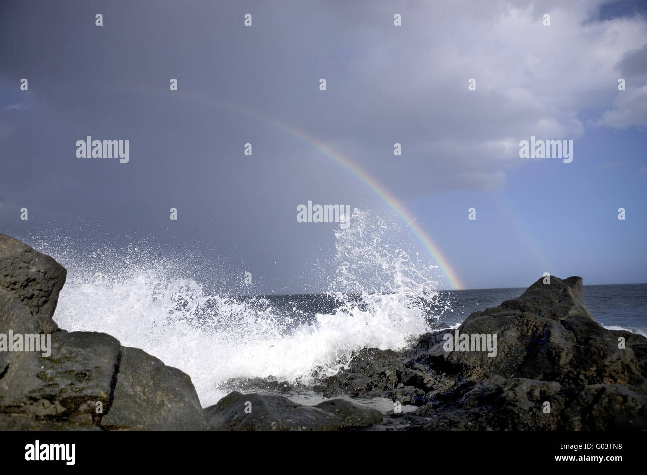 ocean waves and rainbow Stock Photo - Alamy