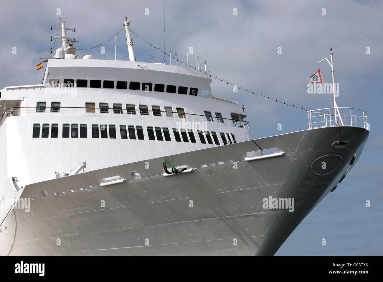 Big white cruising ship in the port Stock Photo - Alamy