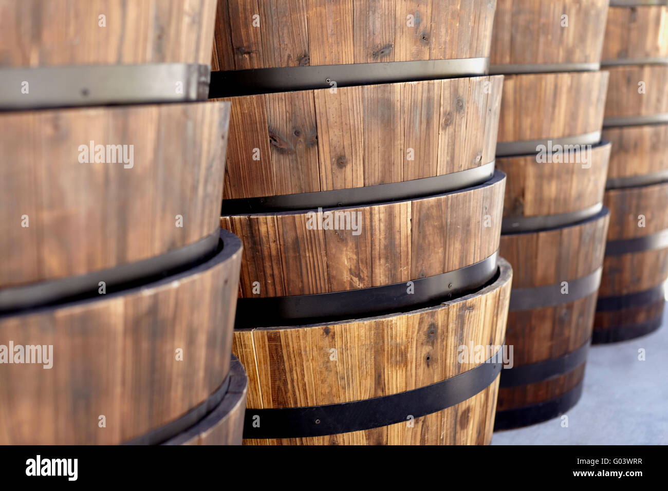 Close Up of a stack of wood barrel planters for interior or exterior ...