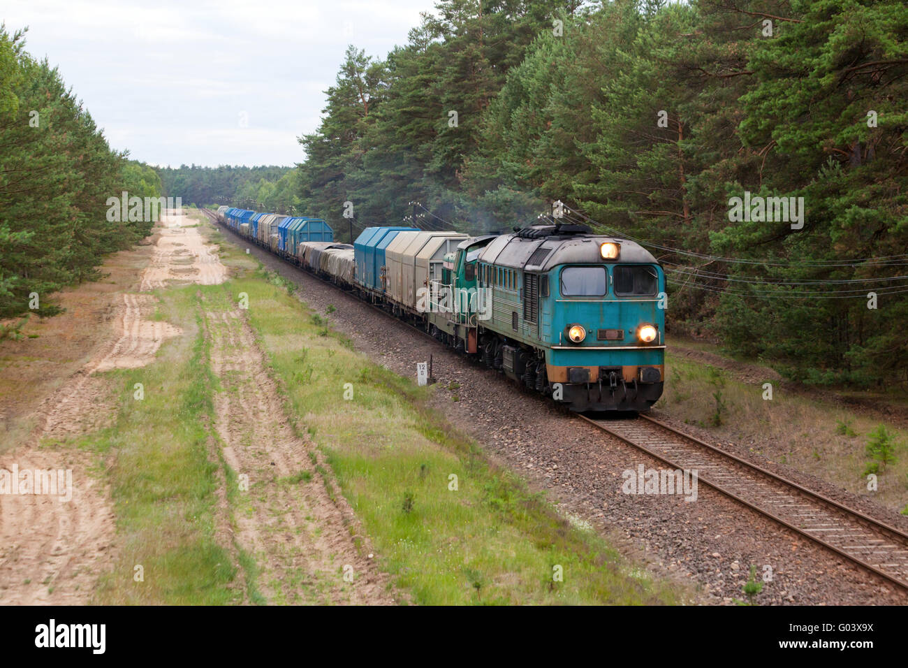Freight train hauled by the diesel locomotive pass Stock Photo - Alamy