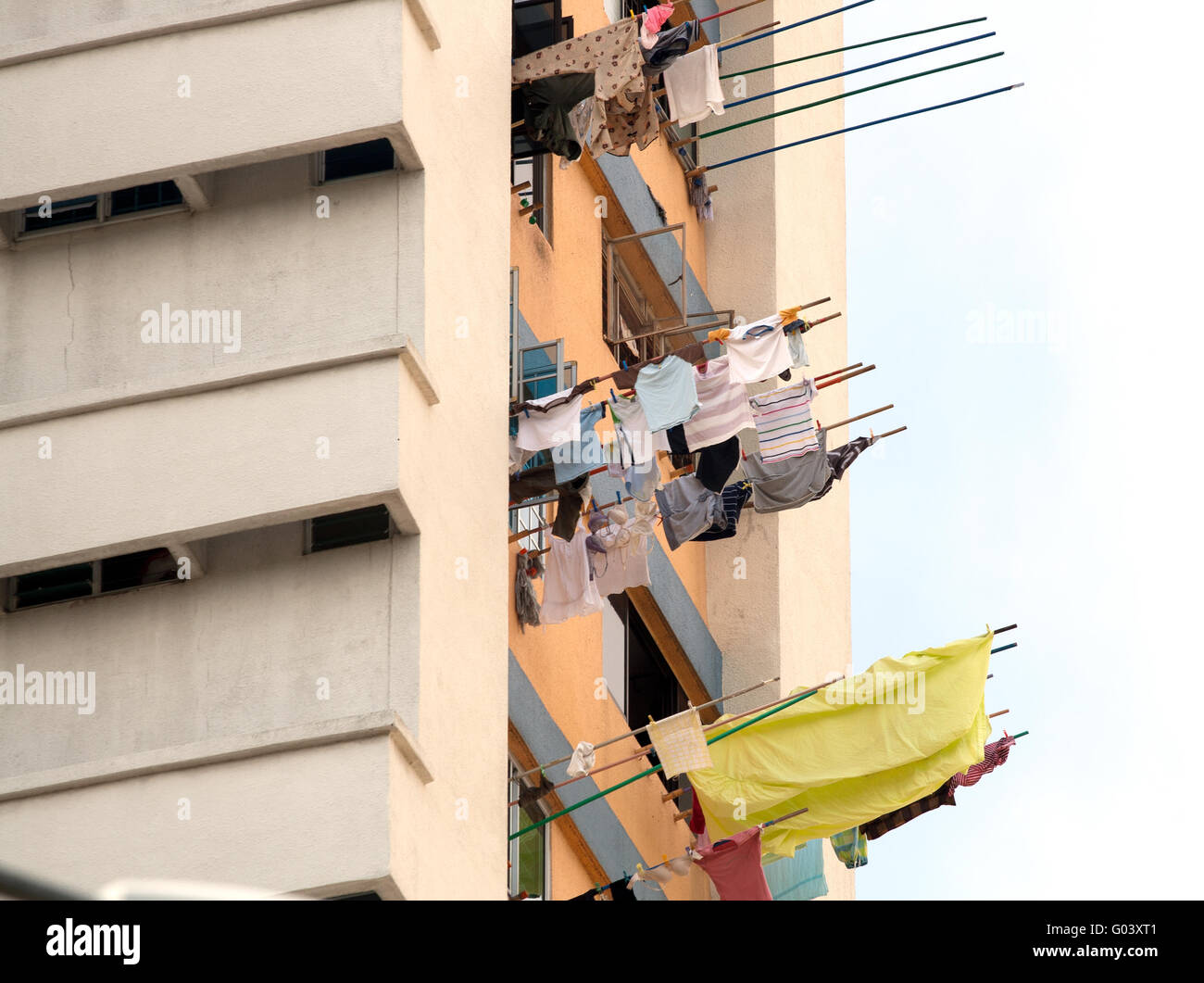 Laundry hanging out of window to dry. Singapore re Stock Photo - Alamy