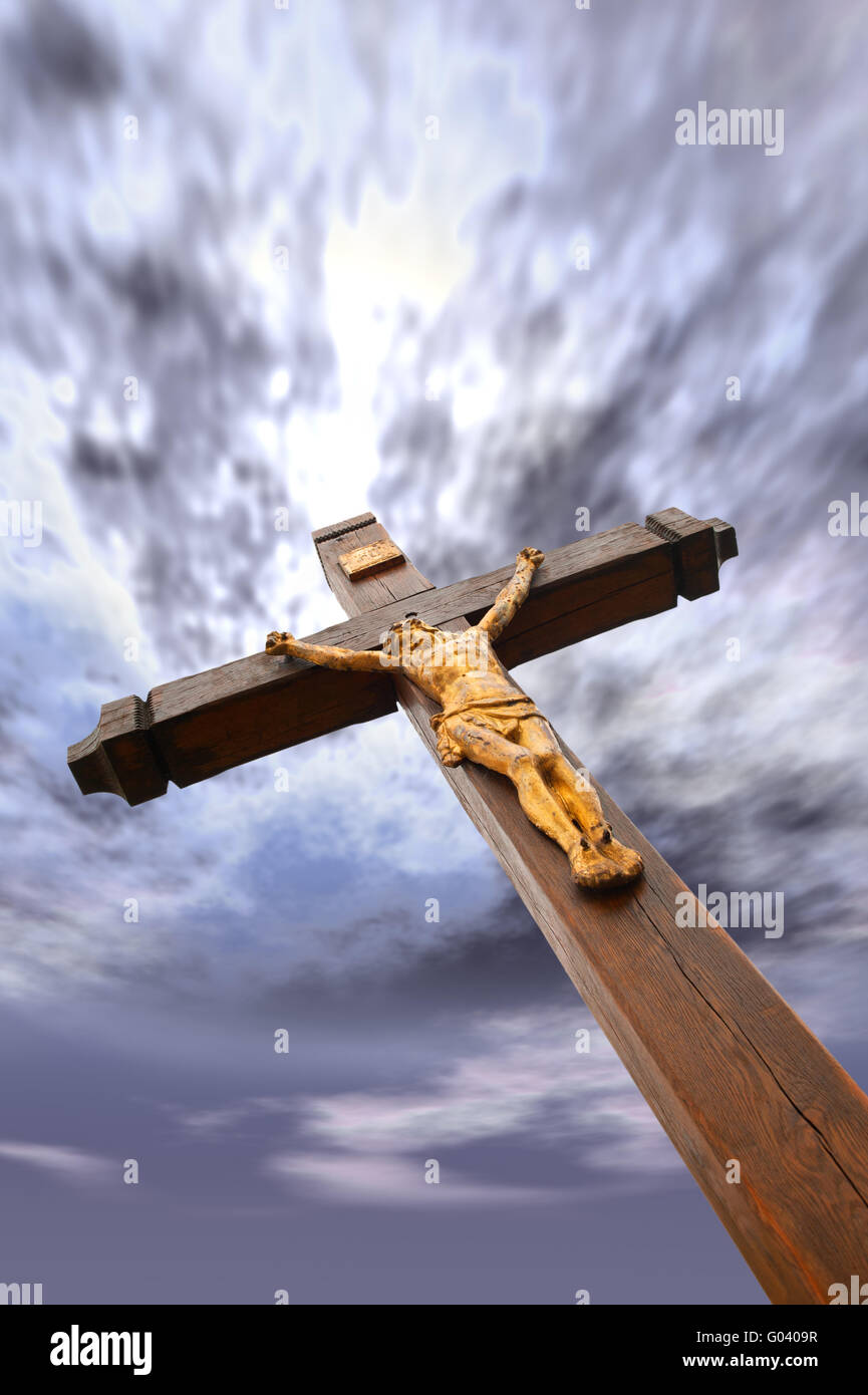 The crucifixion from a tree with Jesus's gilt figure Stock Photo - Alamy