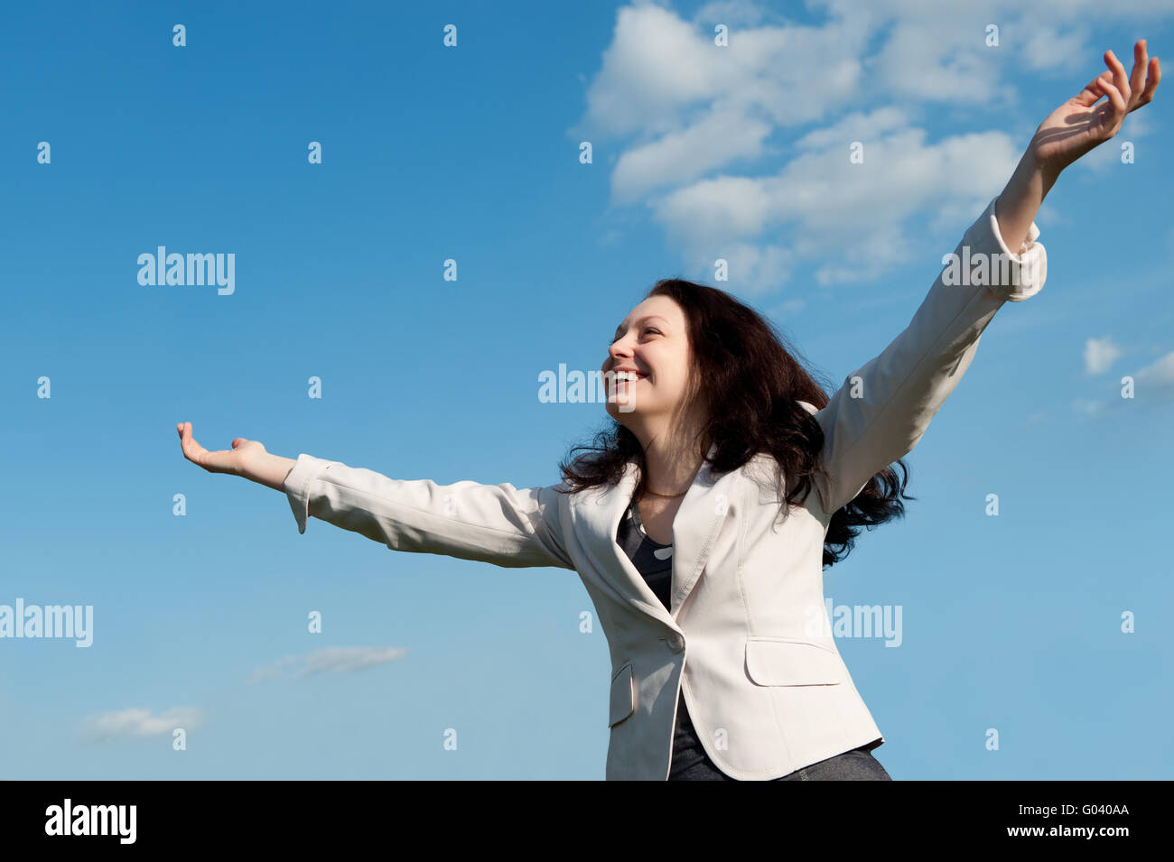 The happy attractive woman with the lifted hands Stock Photo - Alamy