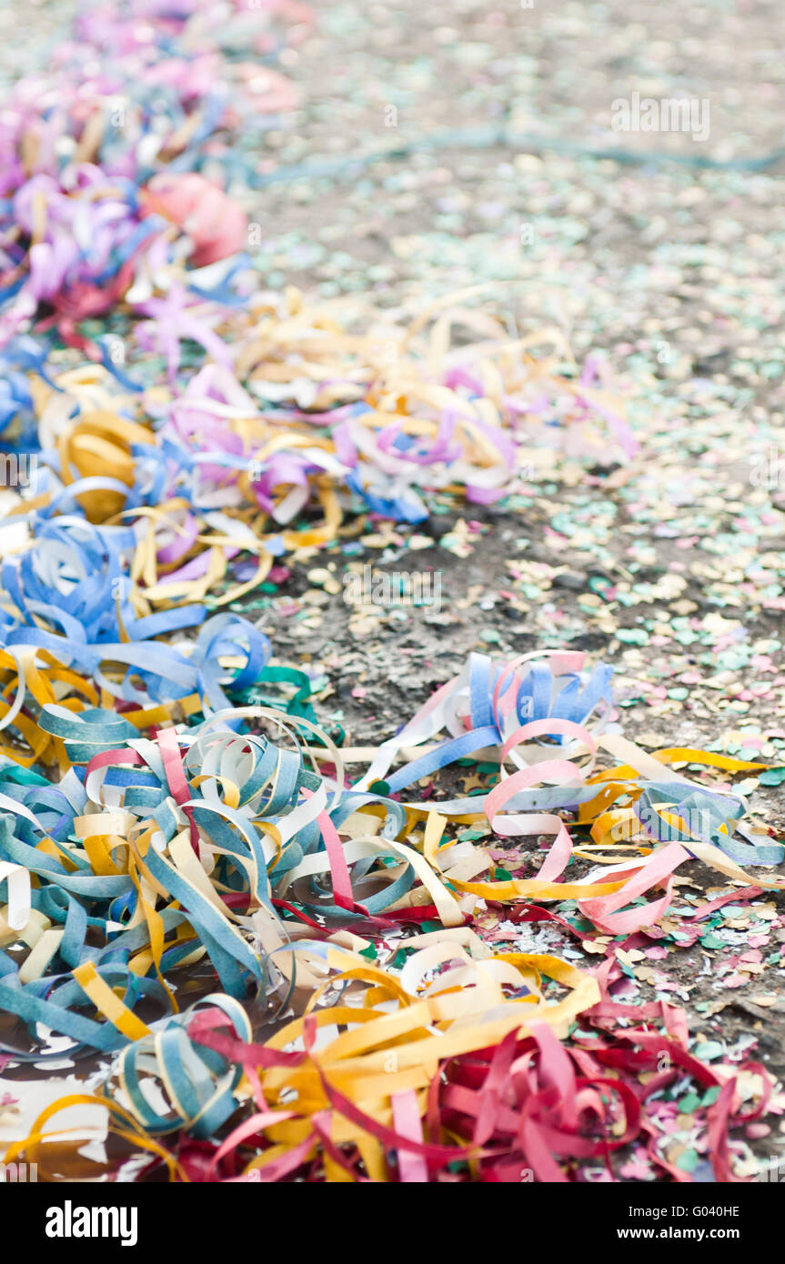 colorful confetti and streamers at the street after Carnival Parade ...