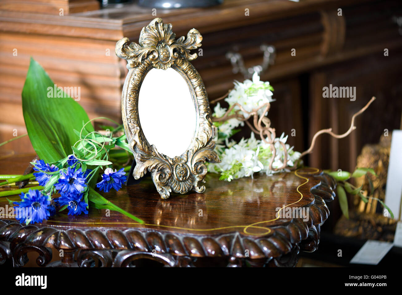 Still life with antique frame with woman's portrait and flowers Stock ...