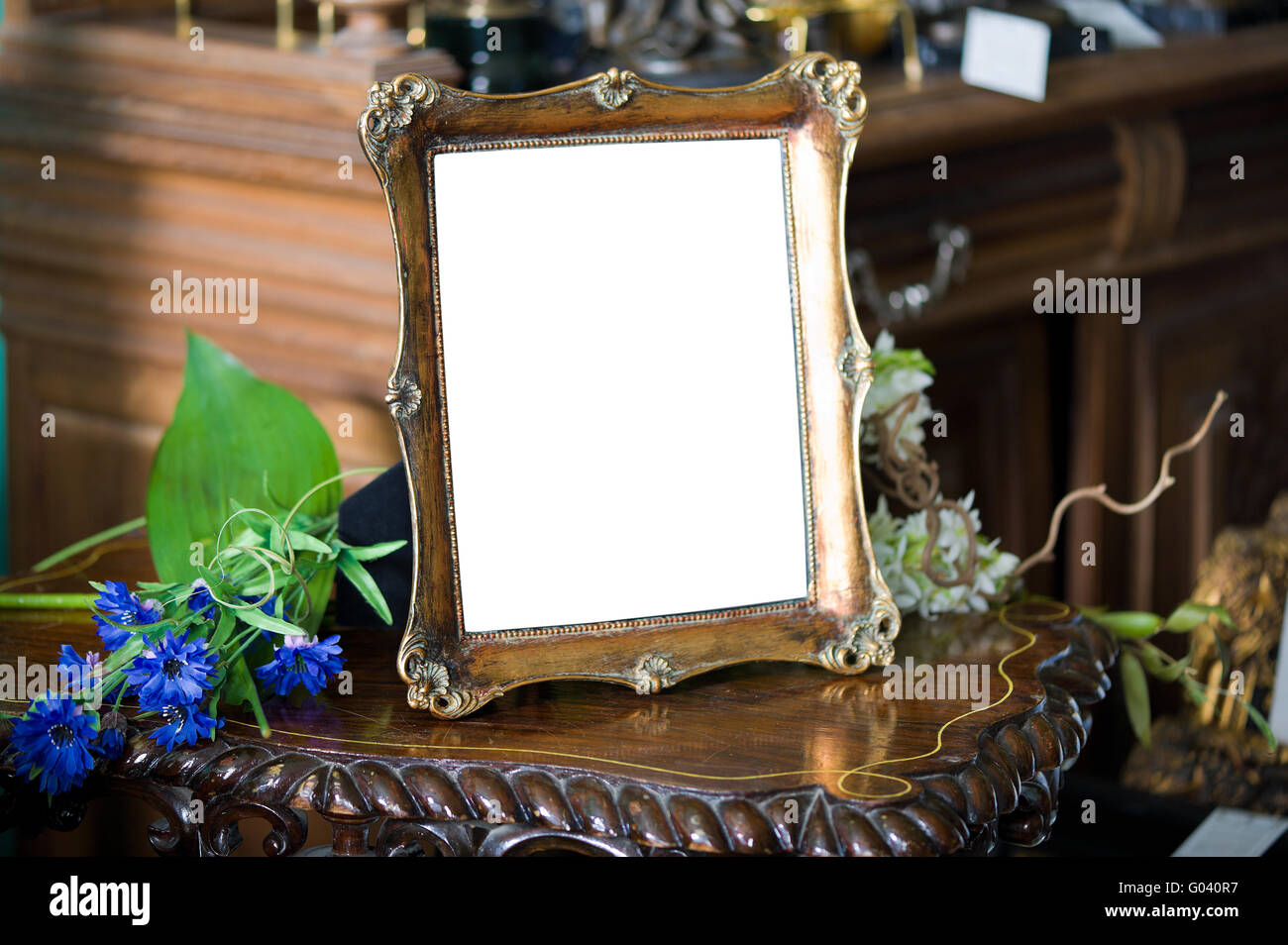 Still life with antique frame with woman's portrait and flowers Stock ...
