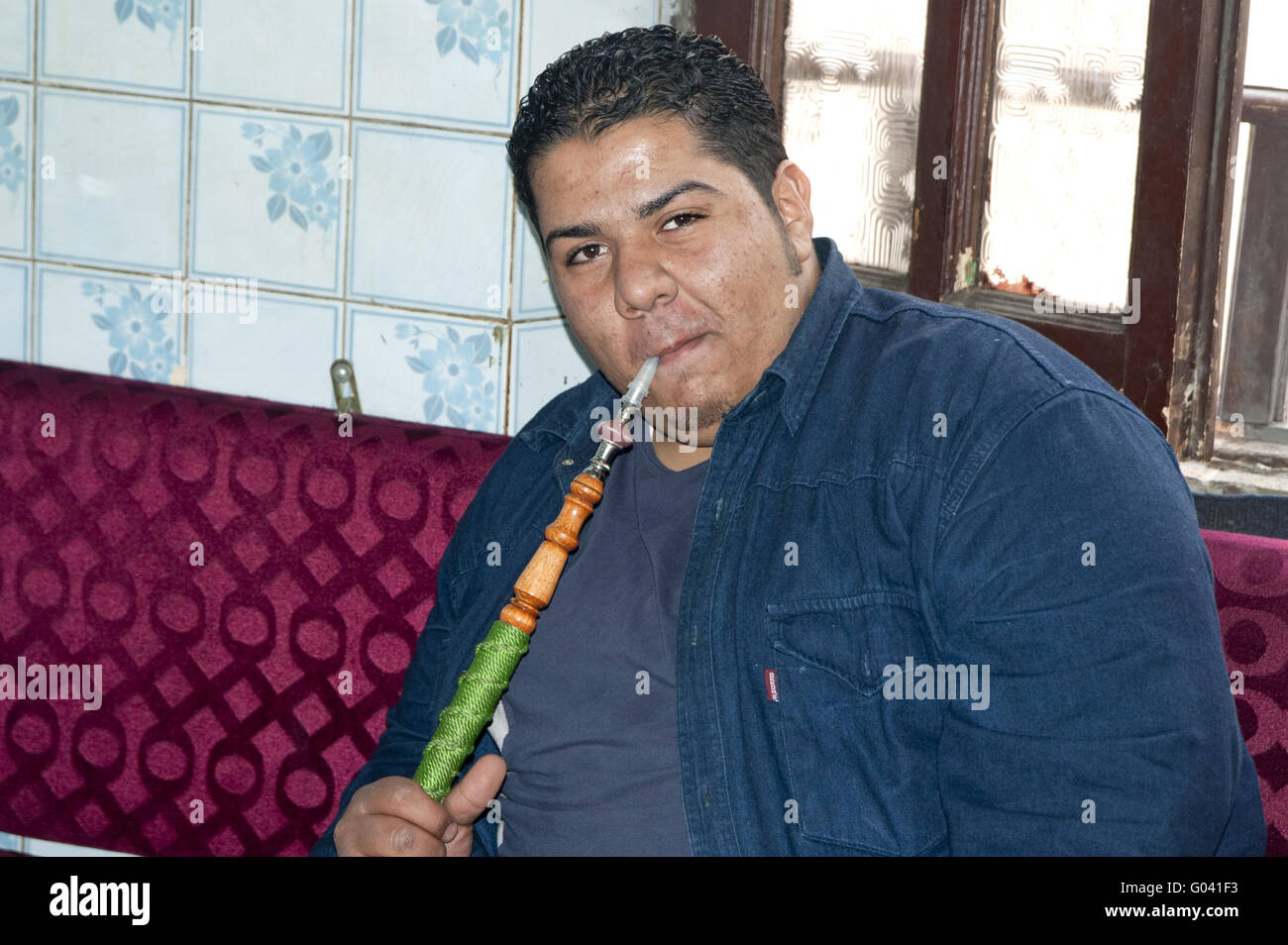 Arab man smoking a waterpipe, Tripoli, Libya Stock Photo - Alamy