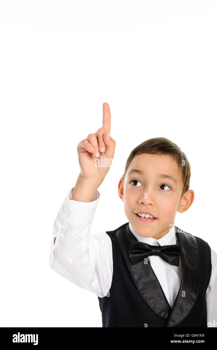 school boy in black suit touching something with his finger isolated on ...