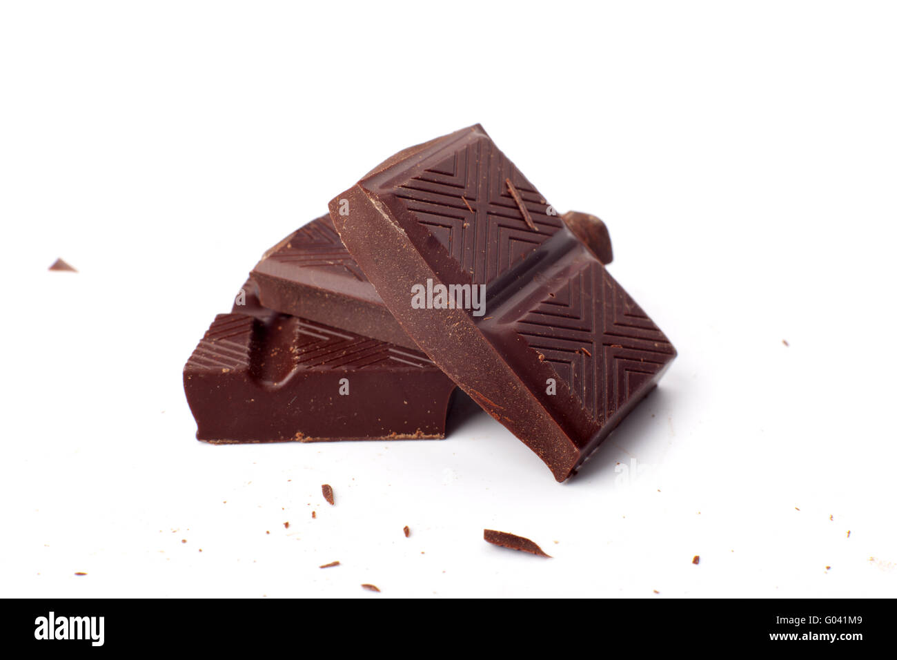 Heap of chocolate fragments on a white background it is isolated Stock ...