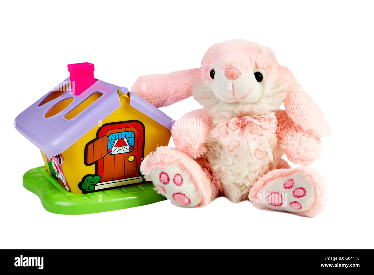 Soft toy and small house isolated on a white background Stock Photo - Alamy