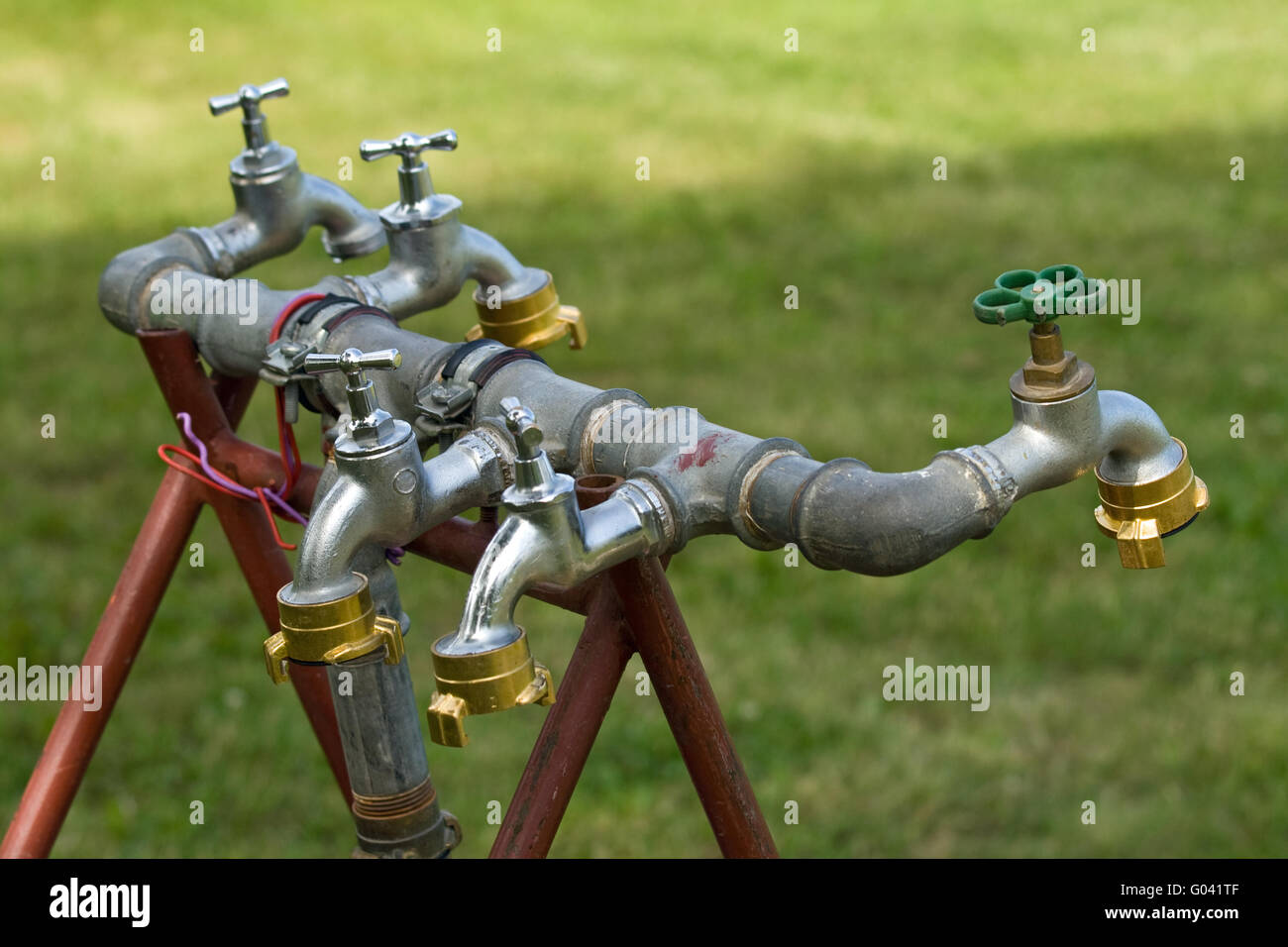 Five water taps Stock Photo - Alamy