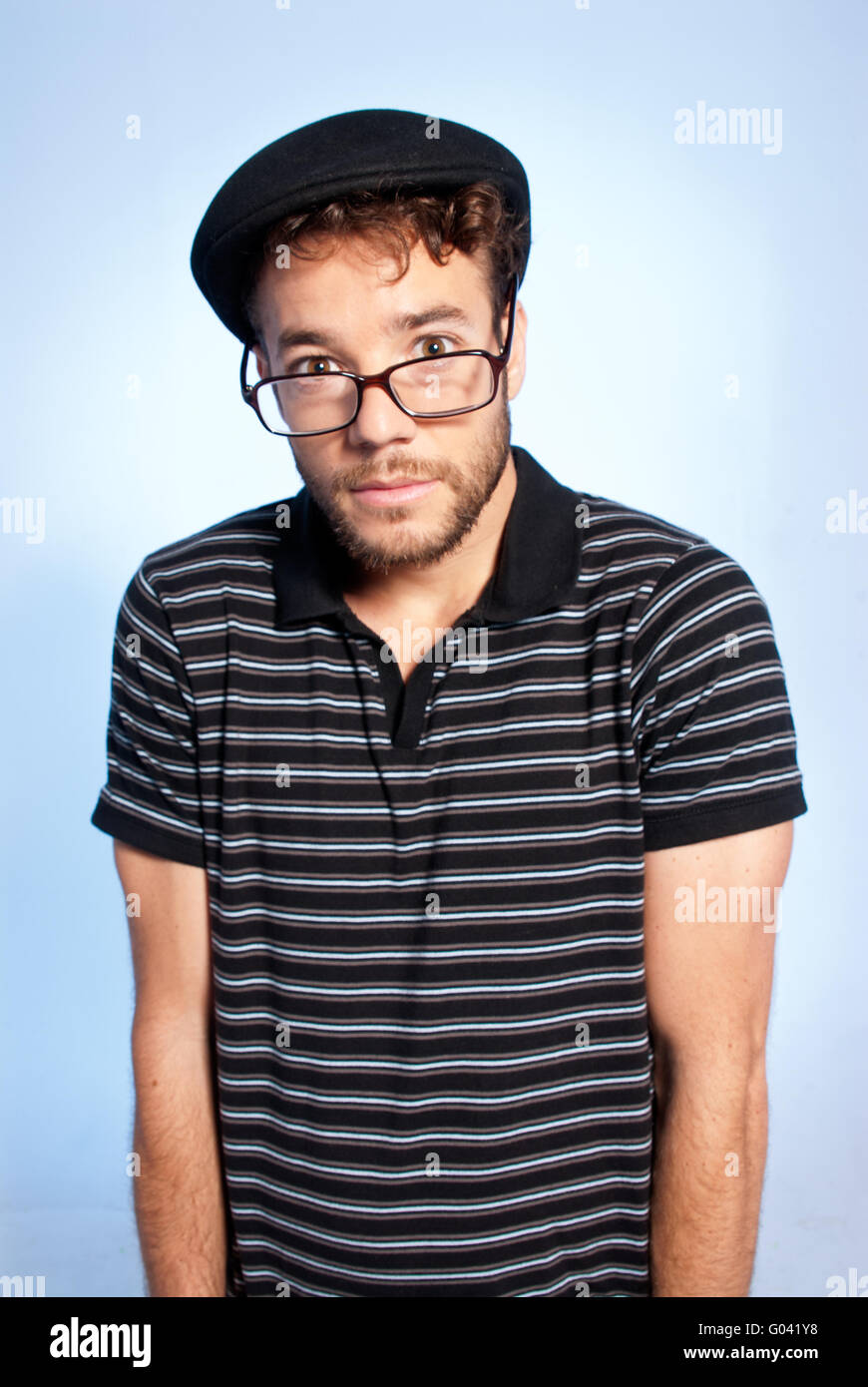 Young man modern nerd wide angle portrait blue background Stock Photo ...