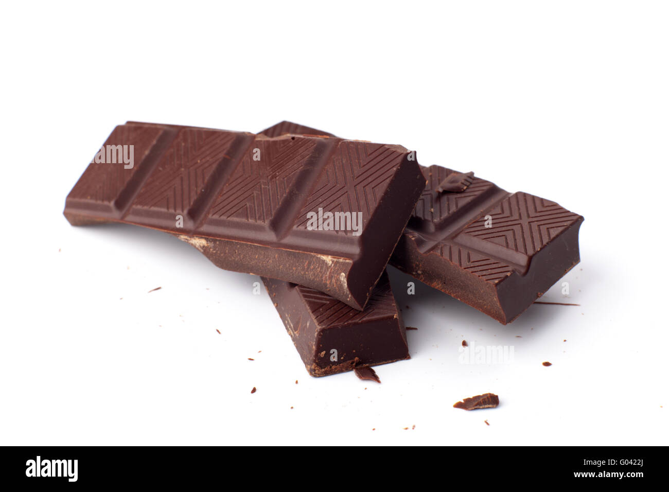 Heap of chocolate fragments on a white background it is isolated Stock ...